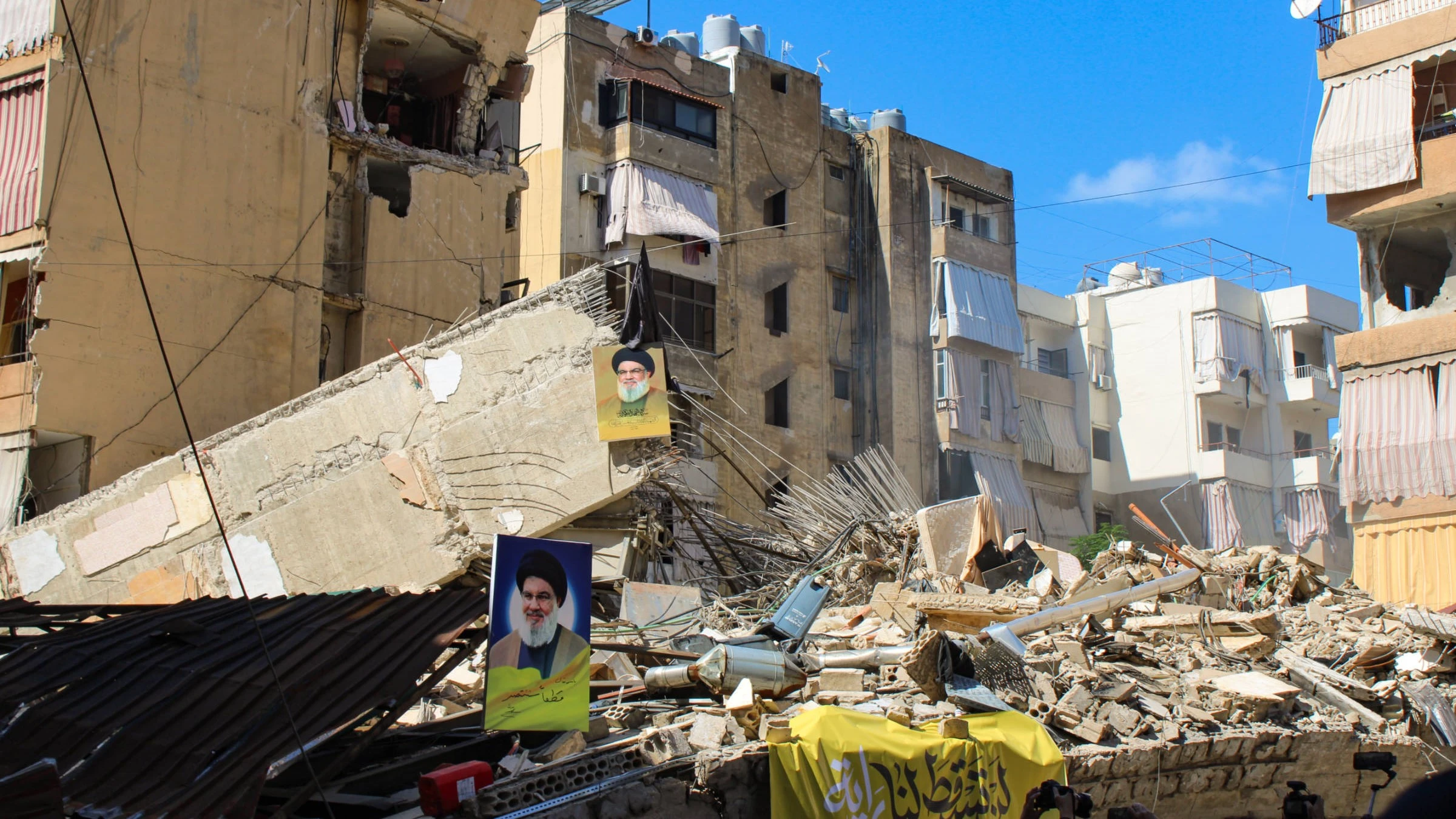 Israel levels building steps away from Hezbollah press conference