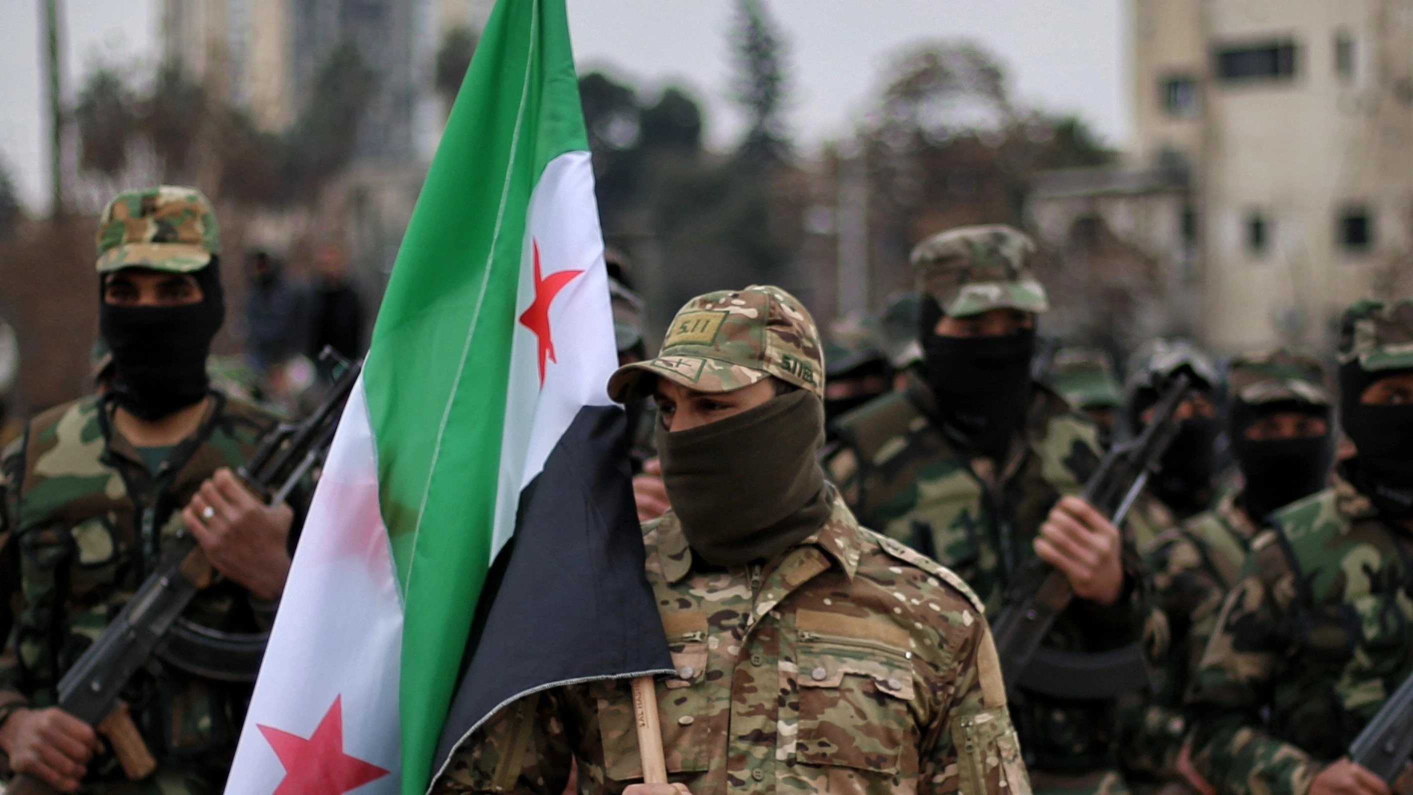 Syria issues deadline for remaining armed groups to join defense ministry